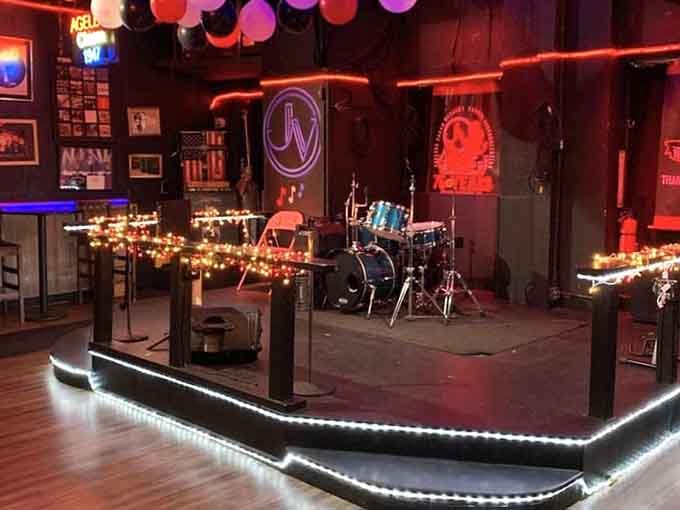 The Music Room stage glows with possibility, ready to host another night of live entertainment and good times.