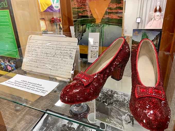 Ruby slippers that launched a thousand dreams, still sparkling with the promise of home after all these years.