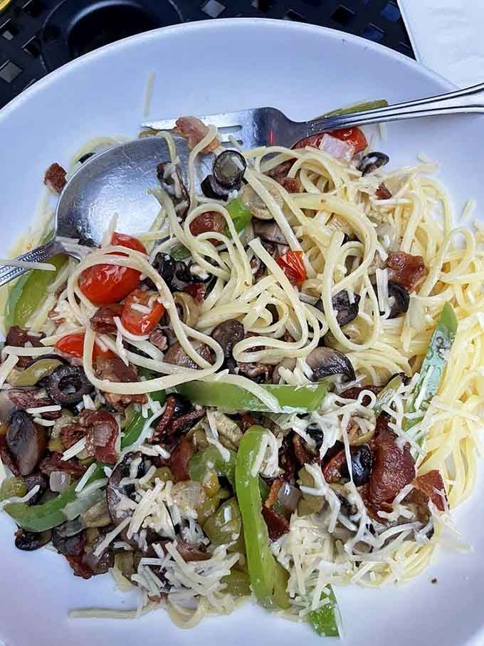 The Greek Deluxe brings Mediterranean sunshine to Ohio, loaded with olives, bacon, and enough cheese to smile about.