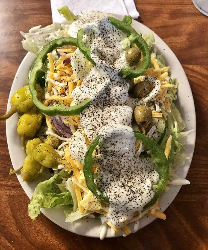 A loaded salad bar creation topped with enough fixings to make you feel virtuous before diving into that seafood basket.