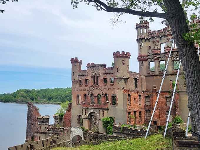 The main arsenal building still commands attention despite missing its roof, walls open to sky like ancient Roman forums.