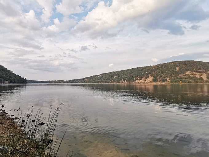 Devil's Lake's calm waters belie the dramatic bluffs surrounding it, creating scenery that belongs on a postcard or screensaver.