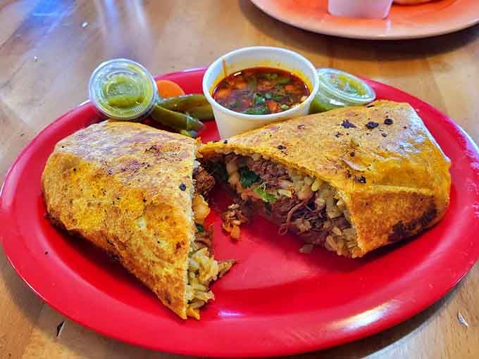 This isn't just a burrito&mdash;it's architecture you can eat. Golden-crisp exterior giving way to a perfectly structured interior of rice, meat, and beans.