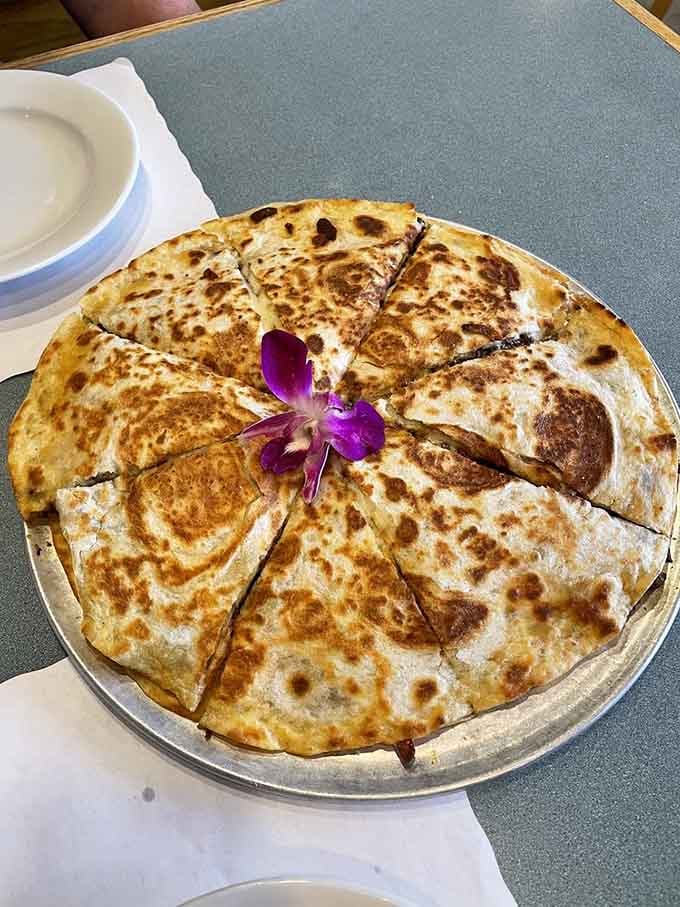 This quesadilla pizza hybrid isn't having an identity crisis &ndash; it's having a delicious epiphany, complete with an orchid crown.
