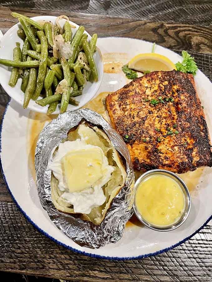 Blackened salmon that's crispy outside, tender inside&mdash;with a baked potato that's having its own moment of glory.