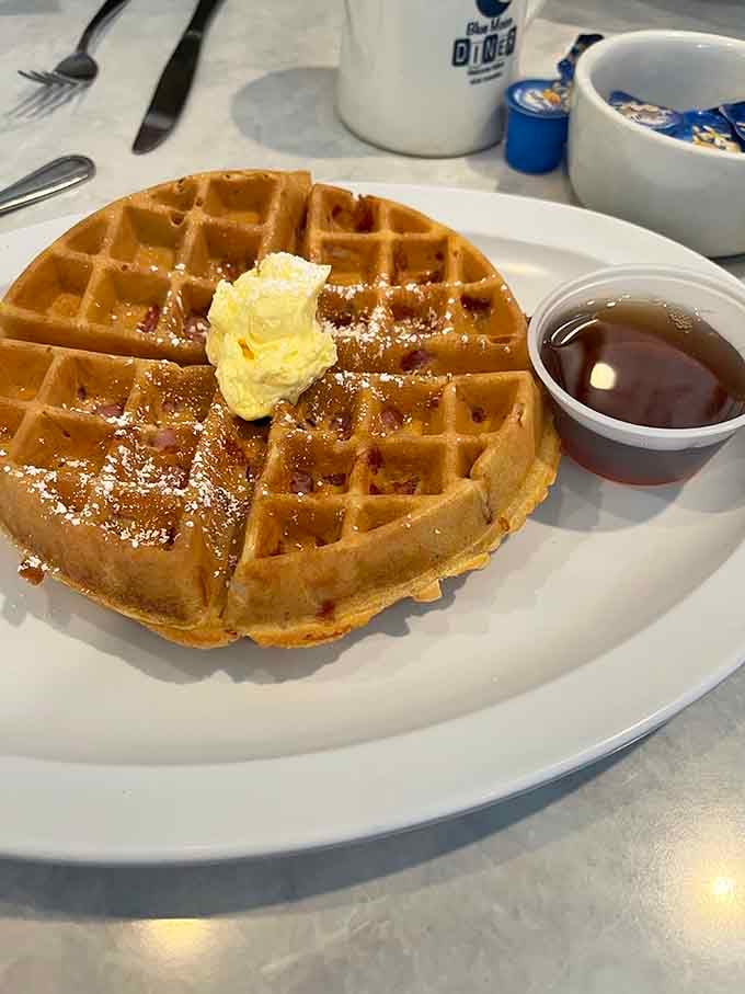 That waffle's golden-brown perfection and butter pat deserve their own standing ovation before you dig in.
