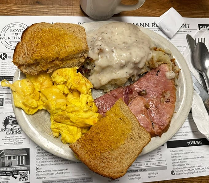 This breakfast plate doesn't mess around: eggs, ham, biscuits with gravy, and toast for when you mean business.