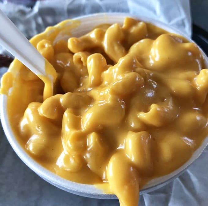 Mac and cheese so creamy and orange, it looks like liquid gold decided to become comfort food.