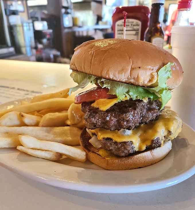 This towering double cheeseburger with crispy fries makes you wonder why anyone settles for sad fast-food versions of the same thing.