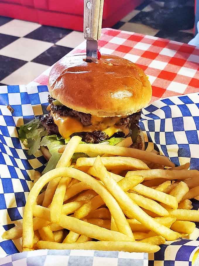 A burger that requires both hands and a strategy. The melted cheese cascading down the sides is nature's most perfect waterfall.