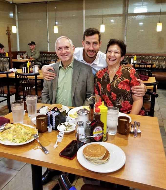 Nothing says "we're having a good time" quite like happy diners surrounded by plates that require strategic planning to finish.