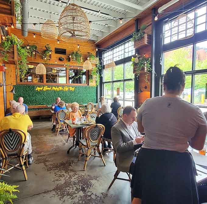 Wicker basket lights and greenery transform industrial space into somewhere you'd actually want to spend your afternoon.