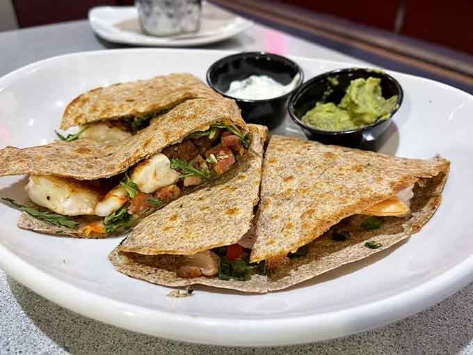 These quesadillas arrive stuffed with Carolina shrimp, proving fusion food can honor tradition while embracing creativity and flavor.