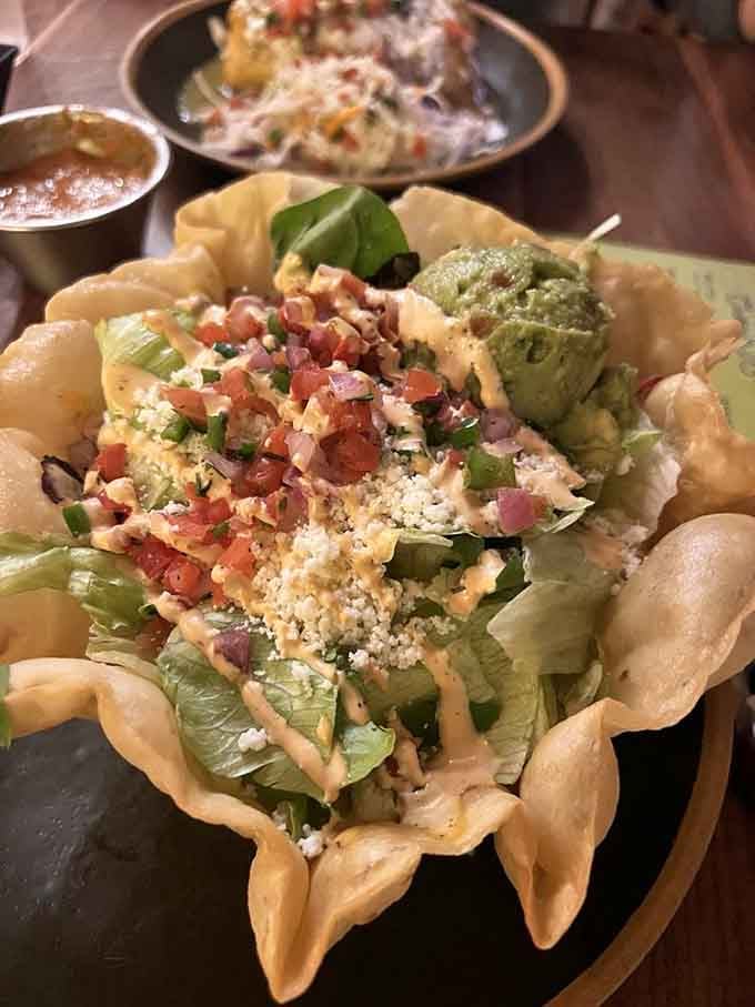 The taco salad in its crispy shell is perfectly normal food in the most gloriously abnormal setting imaginable.