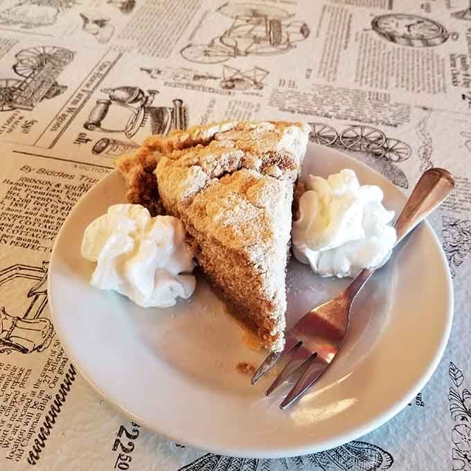 Homemade pie with whipped cream that makes you understand why people write songs about dessert.