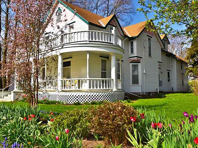 Spring tulips frame the Cather Second Home Guest House, where visitors can literally sleep in history while enjoying the comforts of a beautifully preserved Victorian home.