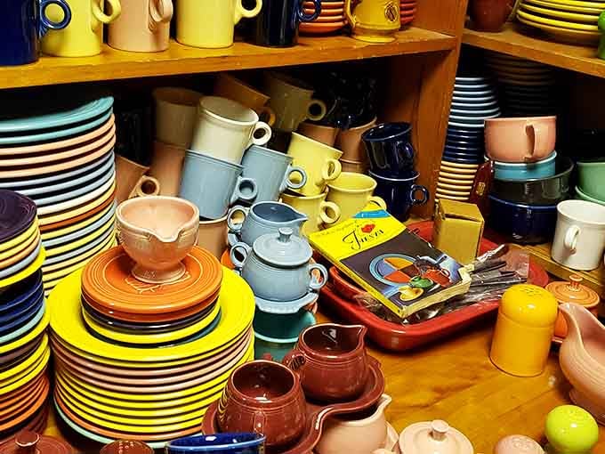 Fiestaware heaven! This rainbow explosion of vintage dishes proves that dinner was simply more fun when your plates matched your kitchen curtains.