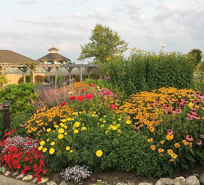 Gardens bloom with the kind of color explosion that makes you want to quit your job and become a full-time gardener.