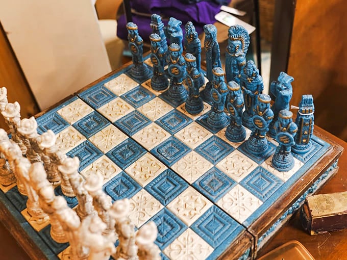 A chess set fit for royalty or at least your living room. These blue and cream pieces have likely witnessed strategic battles spanning generations.