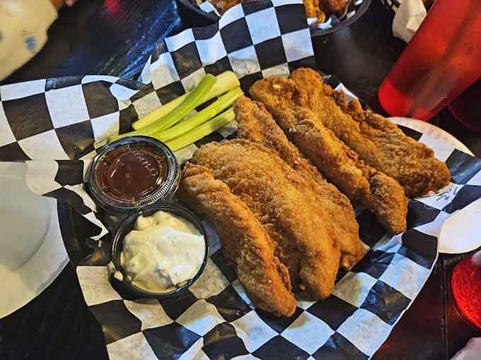 Chicken fingers arrive golden and crispy, proving that sometimes the simplest preparations yield the most satisfying results.