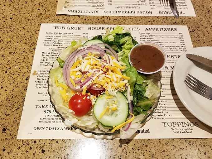A fresh garden salad with all the fixings reminds you that balance exists, even in a pub famous for steak.