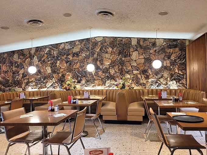 That stunning stone wall mural adds artistic flair while you contemplate your third cup of coffee.