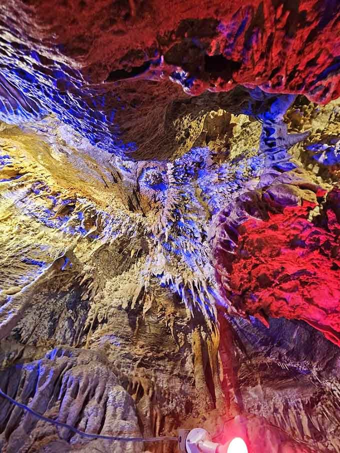 The colored lighting transforms the cave into something between a nightclub and a cathedral, but infinitely cooler.