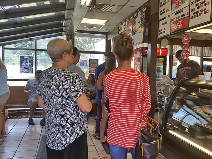 The lunch rush at Just Hamburgers isn't just about food &ndash; it's a community gathering where locals catch up while waiting for their order of Kentucky comfort.