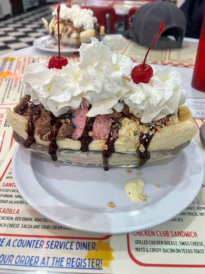 A banana split that looks like it escaped from a Norman Rockwell painting, complete with those mandatory maraschino cherries.