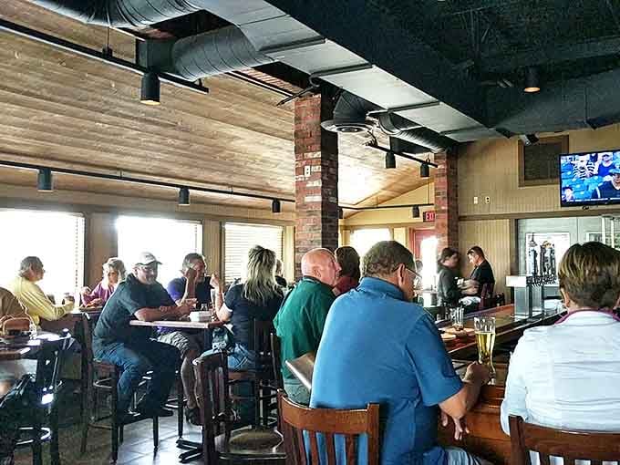 The dining area buzzes with the unmistakable energy of people united in pursuit of exceptional barbecue.