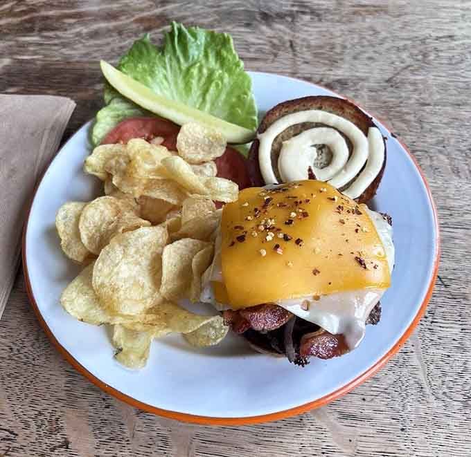 That burger with melted cheese looks like it's auditioning for a food magazine cover shoot.
