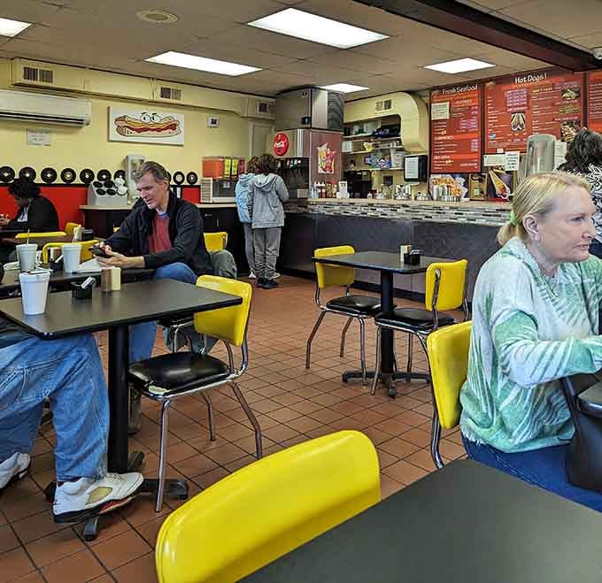 Real people enjoying real food in a real diner, proving authenticity never goes out of style here.