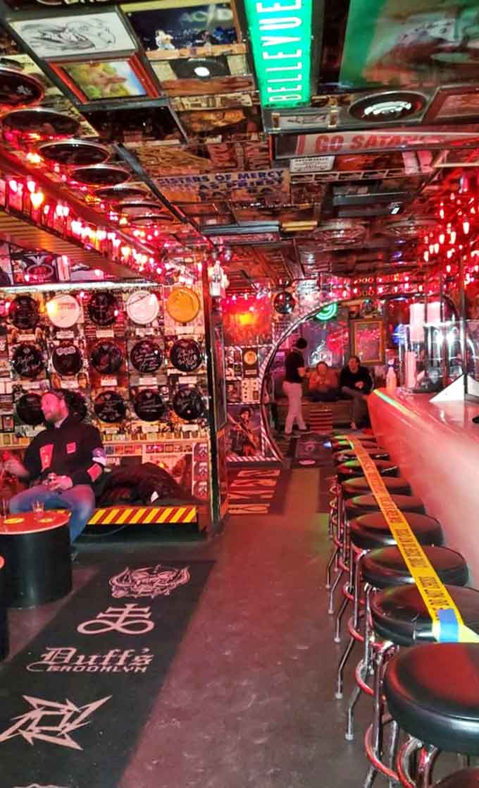 The long bar stretches into infinity, offering countless vantage points for soaking in madness.