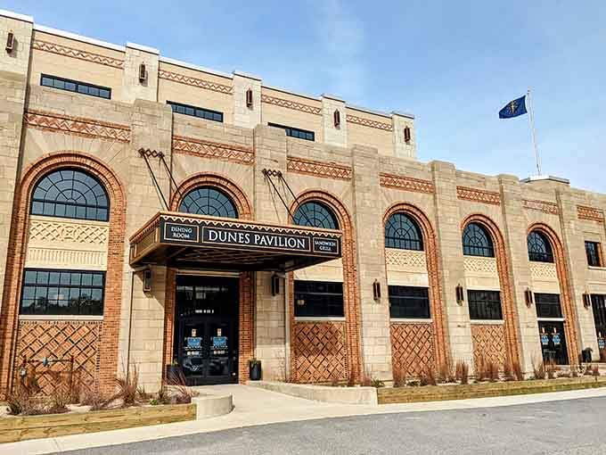 The historic Dunes Pavilion stands as an architectural gem against the blue sky, blending Art Deco elegance with Midwestern practicality.