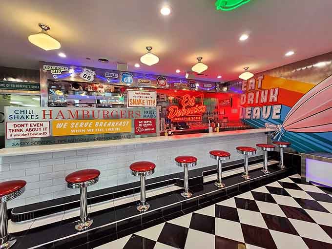 Counter seating where you can watch the show unfold while vintage signs remind you that attitude is always on tap.