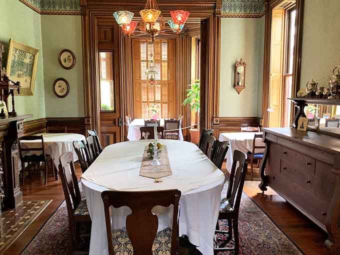 The dining room table seats enough guests to require a seating chart, place cards, and possibly a small megaphone for conversation.