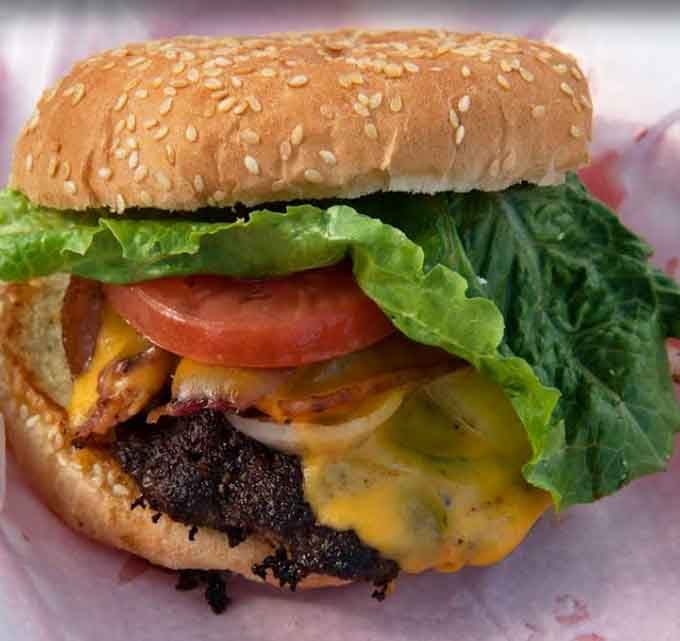 A burger this loaded with fresh toppings proves that diners know their way around lunch just fine too.