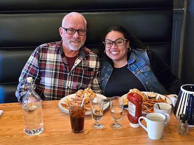 Happy diners enjoying their feast, because nothing brings people together quite like exceptional food and good company.