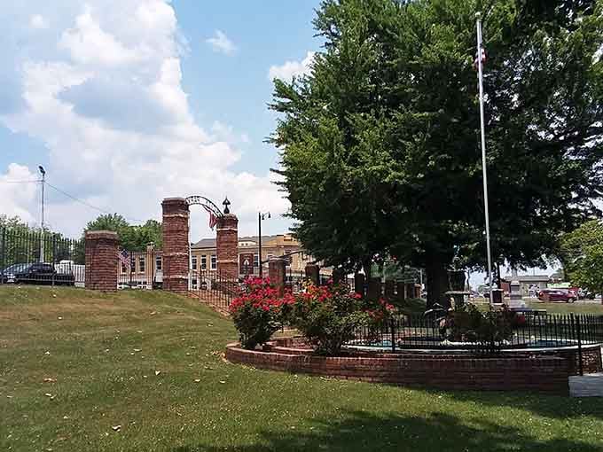 This peaceful park entrance invites you to relax and take in the serene surroundings of this charming town.