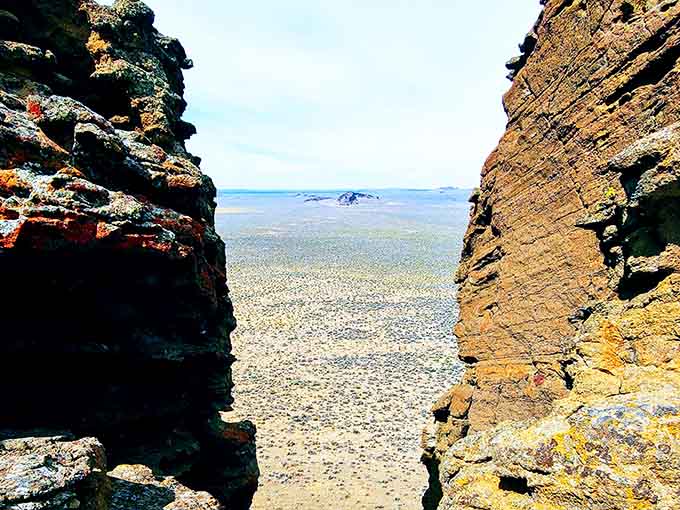 Peer through the ancient rock walls and witness the vast desert expanse that once lay beneath water.