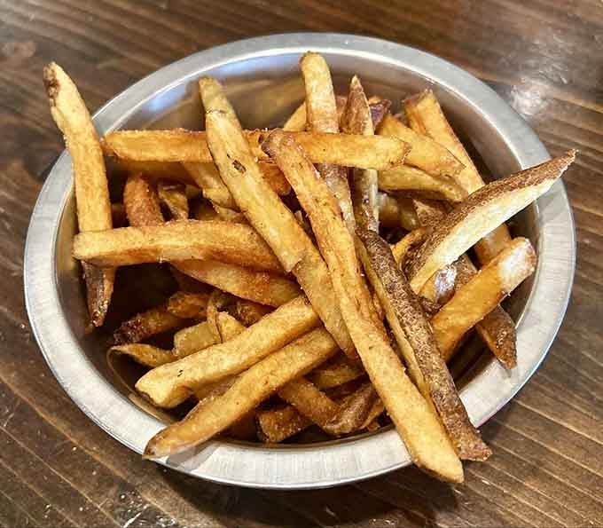 Hand-cut fries with the perfect crisp-to-fluffy ratio—the supporting actor that sometimes steals the whole show.