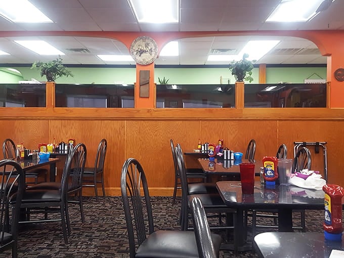 Bright walls and comfortable seating create the kind of welcoming atmosphere that makes lingering over coffee feel mandatory.