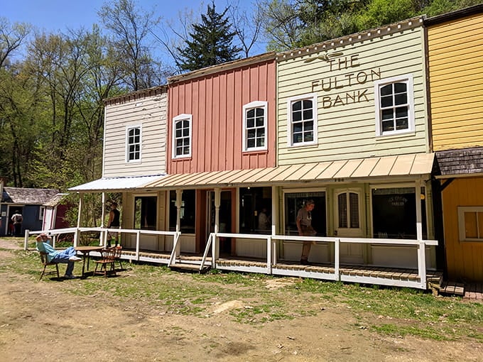 Step into recreated frontier buildings where history comes alive without requiring a smartphone app to explain it.