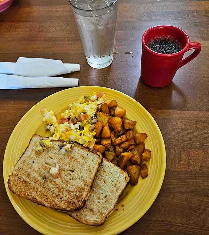 A perfectly balanced breakfast plate with eggs, toast, and those glorious home fries we keep talking about.