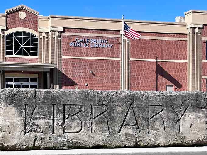 The Galesburg Public Library stands as both knowledge keeper and community living room, where the carved stone entrance announces its mission with Midwestern directness.