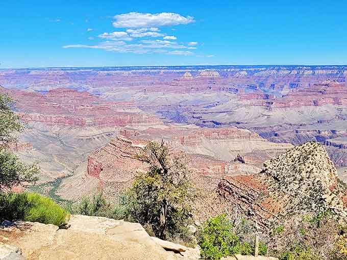 The Grand Canyon's vastness defies both photography and vocabulary. Sixty miles from Williams lies this humbling reminder of nature's patient artistry.