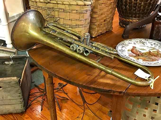 A brass trombone rests among the treasures, waiting for someone to give it a second act in life.