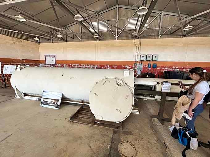 Visitors getting the full tour experience. Nothing says "interesting Saturday" quite like standing next to Cold War weaponry, honestly.