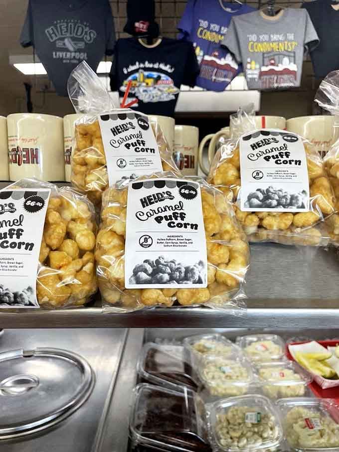 Caramel puff corn bags lined up like edible trophies, because apparently this place wants you leaving happy AND with snacks.