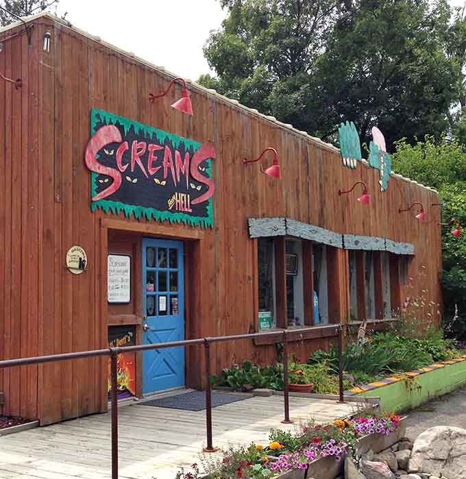 Screams gift shop stands ready with souvenirs, its weathered wood exterior giving off serious Old West meets underworld vibes perfectly.
